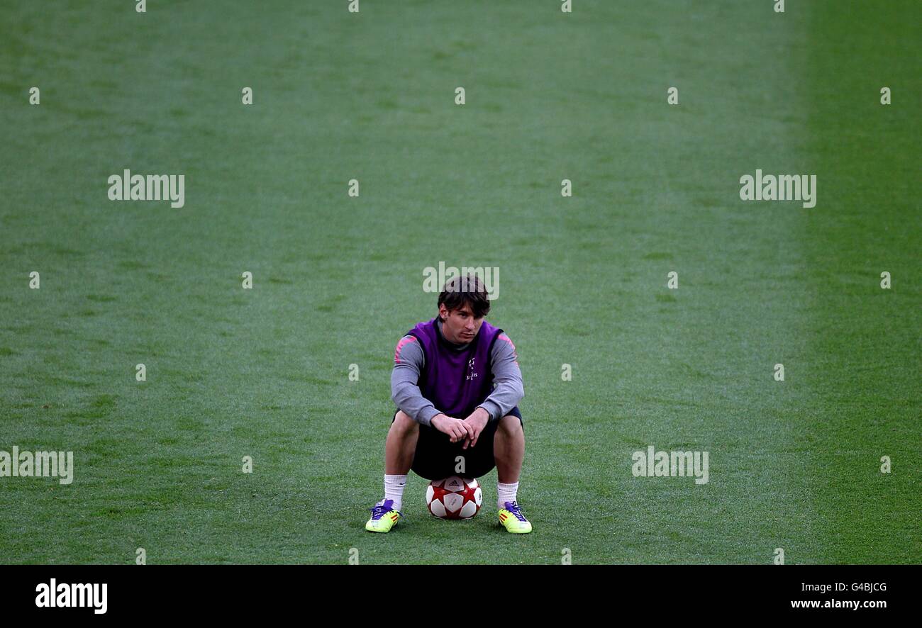 Alternate crop barcelonas lionel messi sits on ball in training hi-res ...