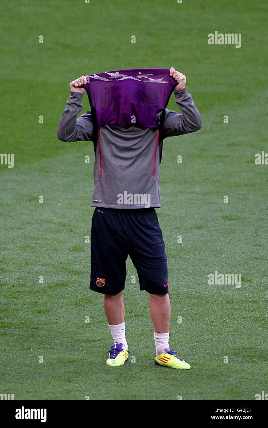 Barcelonas lionel messi covers face hi-res stock photography and images ...