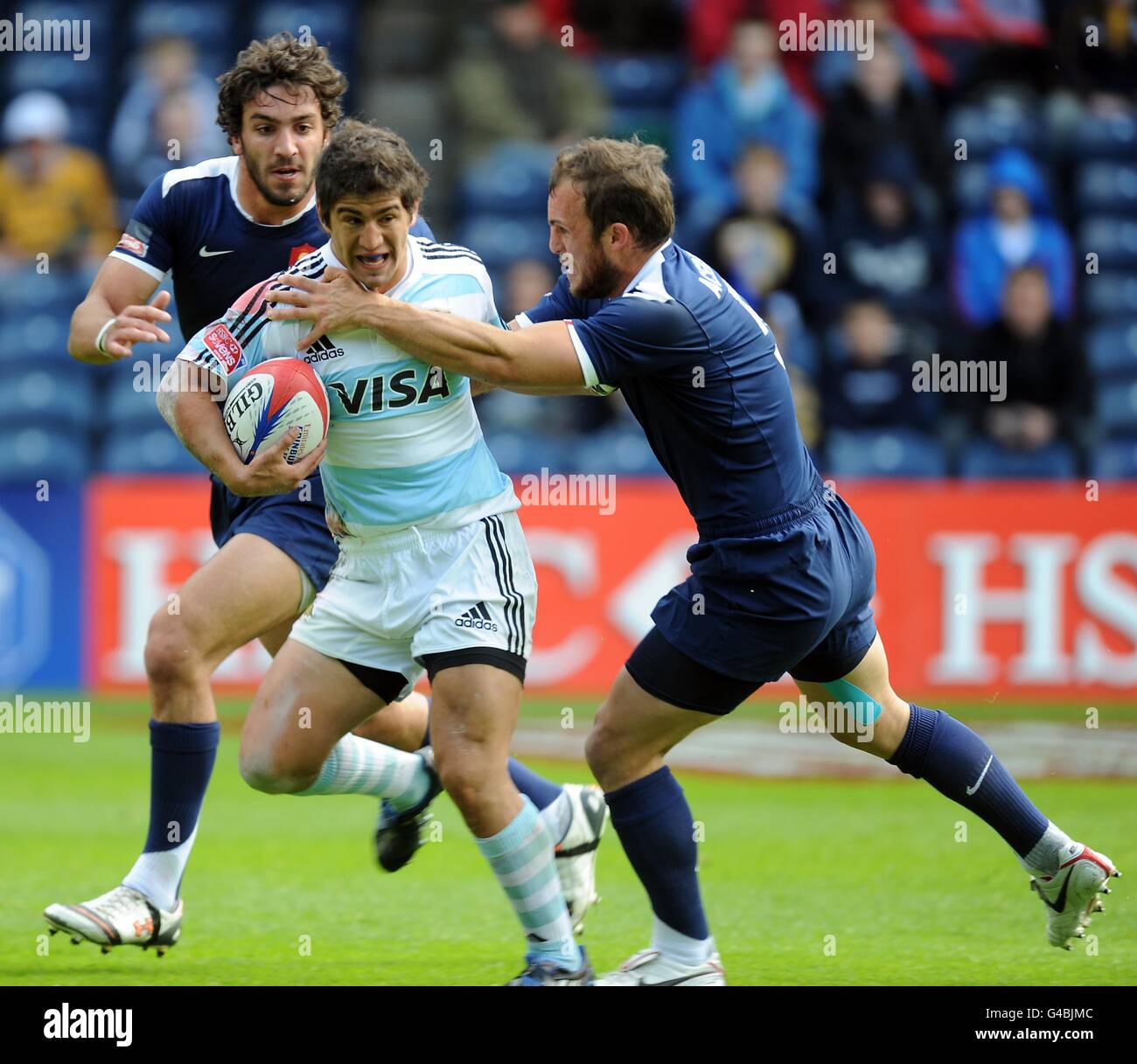 Argentina's Gaston Revol is tackled by France's Mathieu Acebes and ...