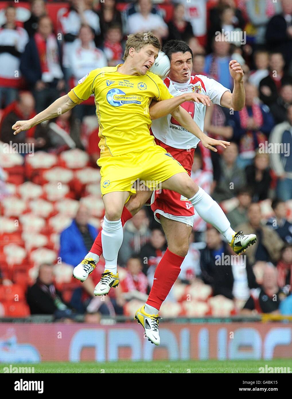 Torquay United's Jake Robinson and Stevenage's Ronnie Henry (right ...