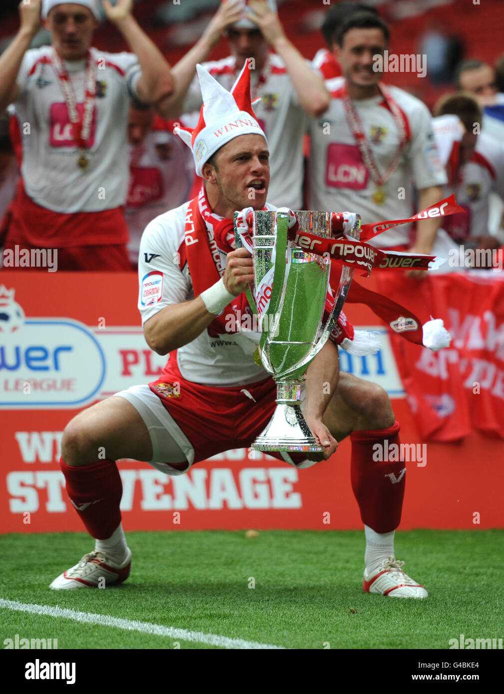 Stevenage's Chris Beardsley celebrates with the trophy after his side ...