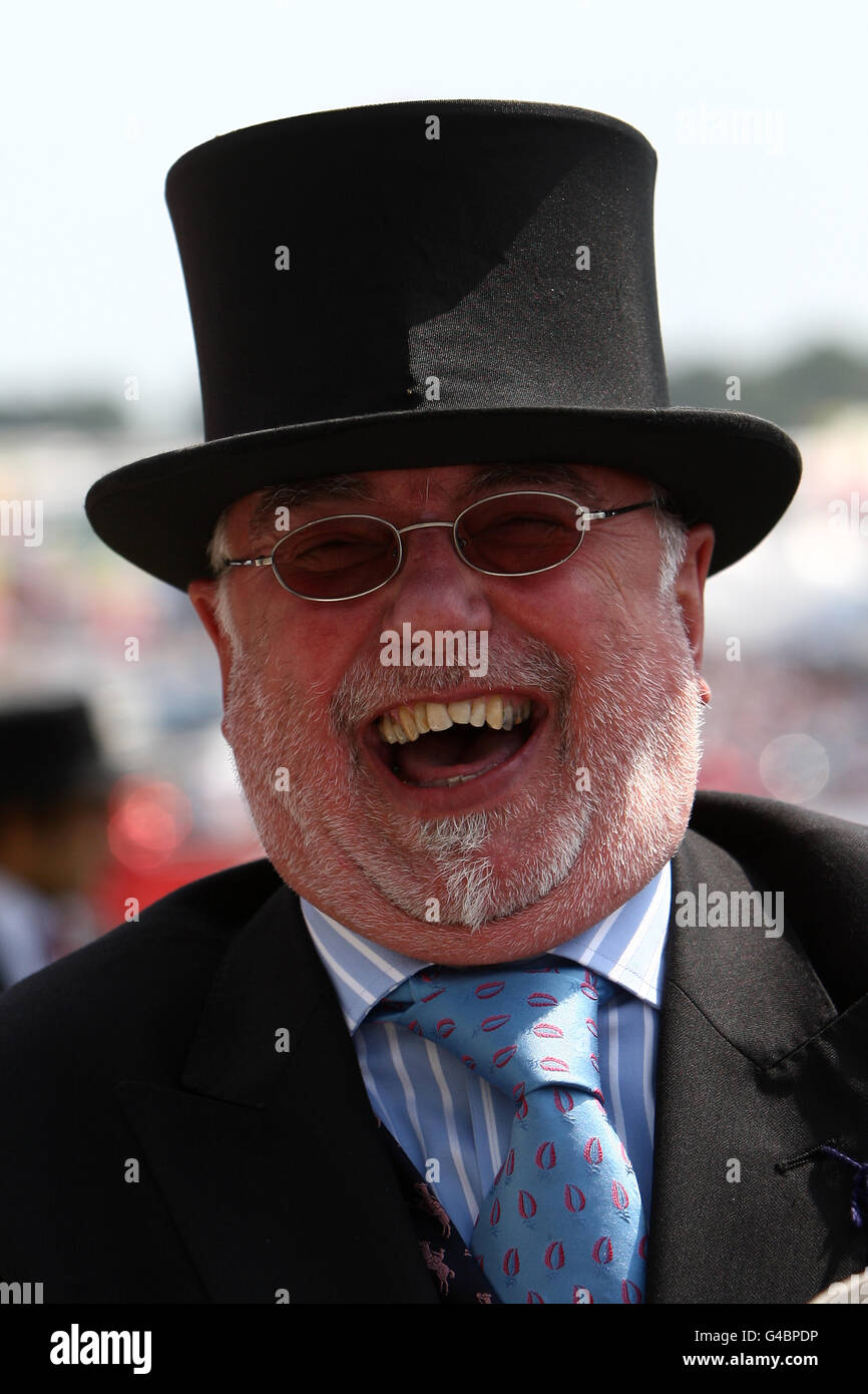 A racegoer wearing a top hat enjoys days racing hi-res stock ...