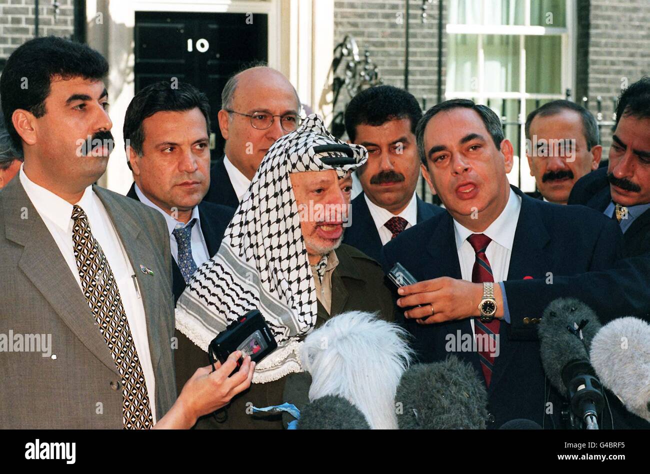 Palestinian leader Yasser Arafat speaking to members of the media ...