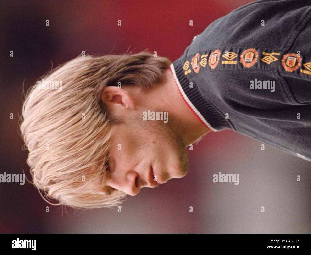 David Beckham shows his new hair look (blond highlights) during the ...