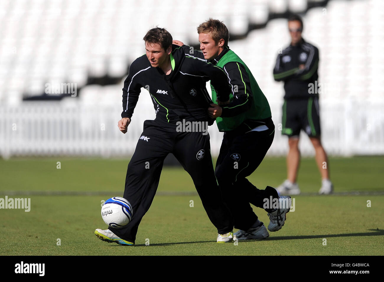 Surrey's Gary Wilson (left) and Jason Roy training with a football ...