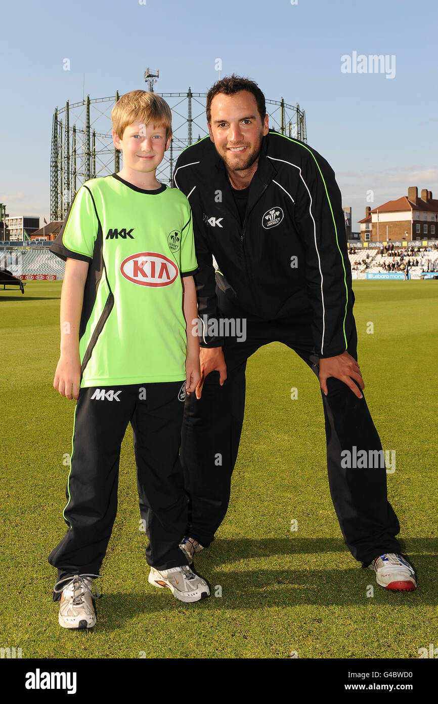 Surrey's Matthew Spriegel poses for a photograph with a young fan ...