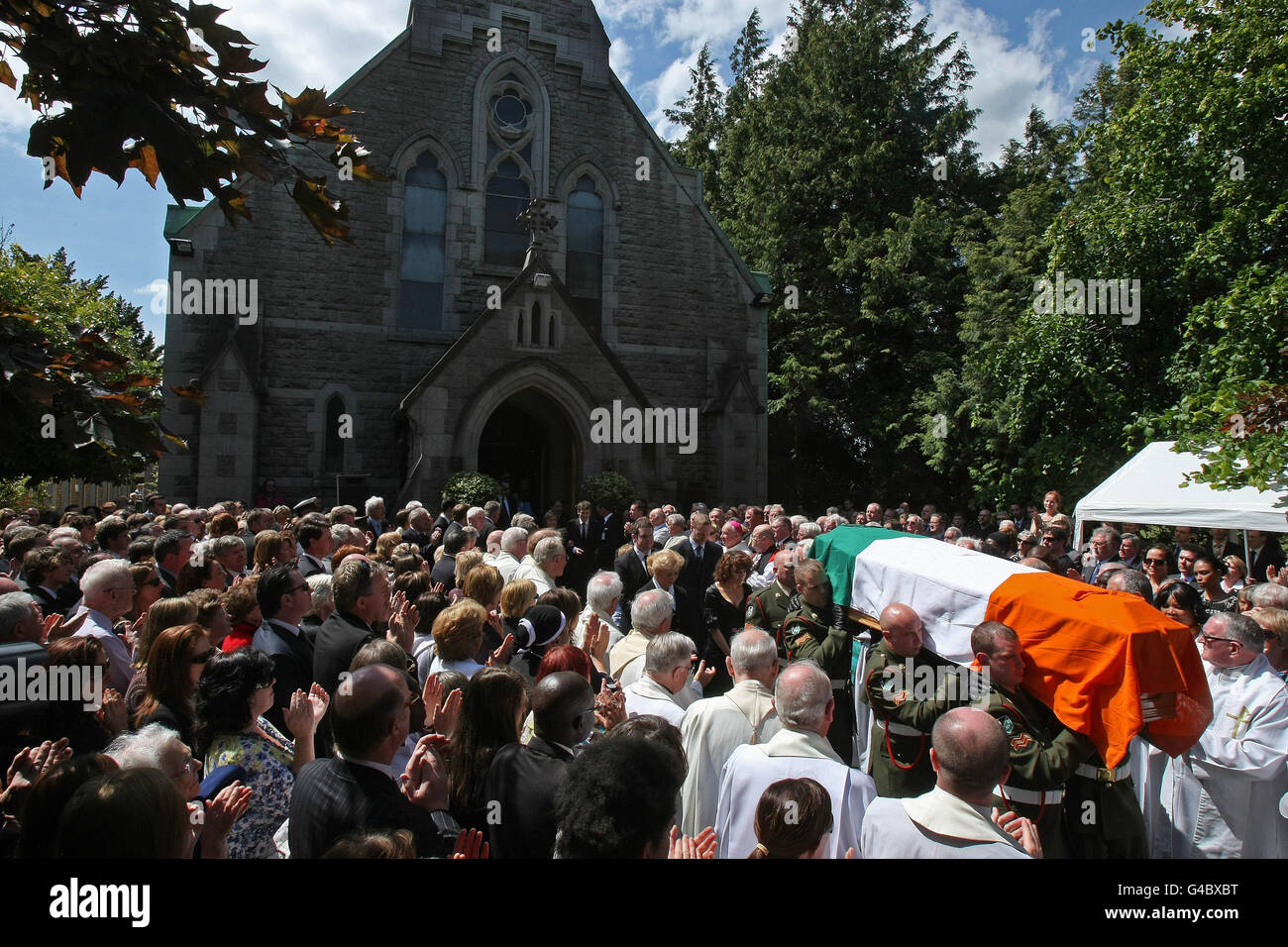 The coffin of former Finance Minister Brian Lenihan is carried from St ...