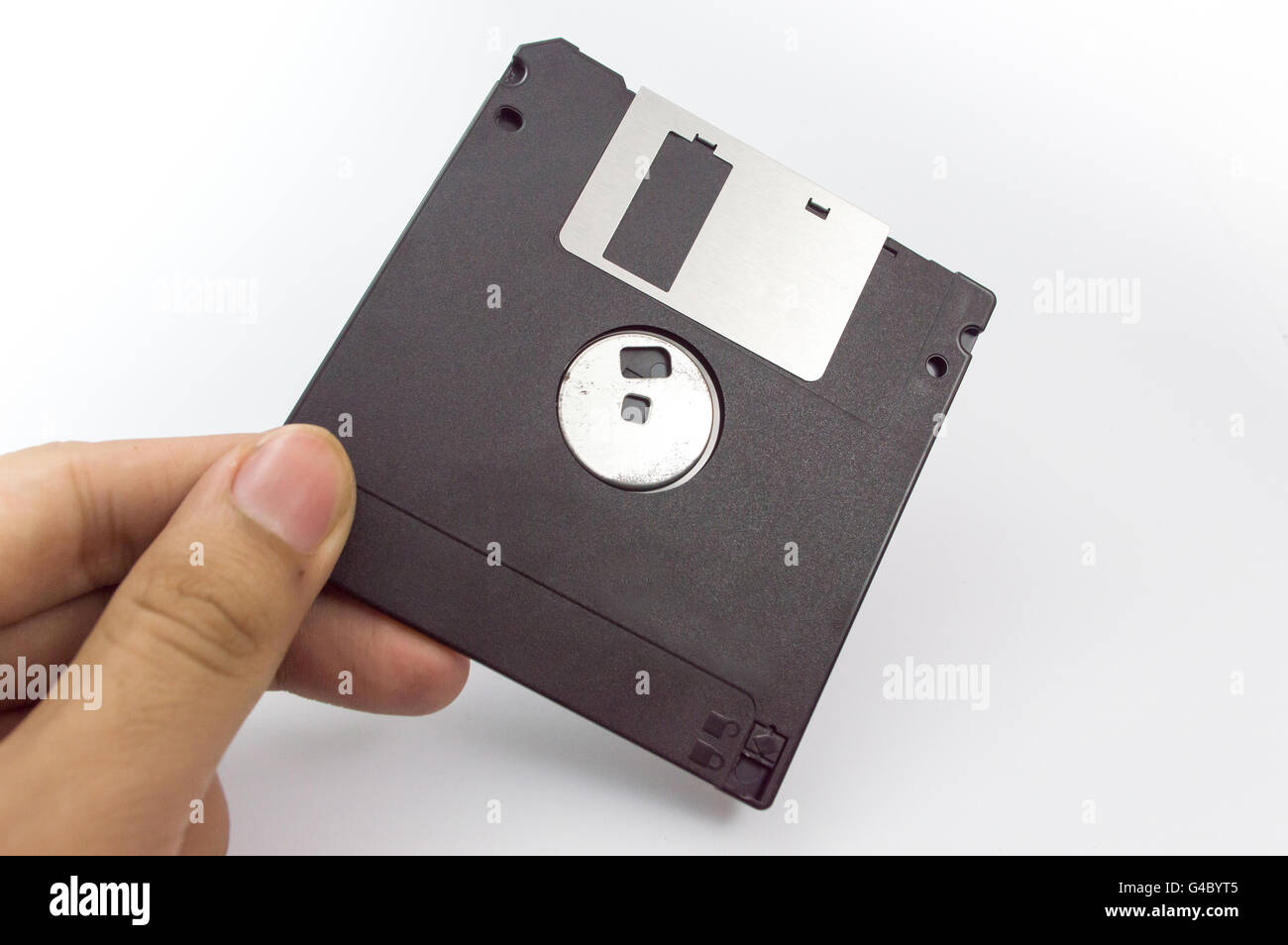floppy disk in hand isolated on white background Stock Photo - Alamy