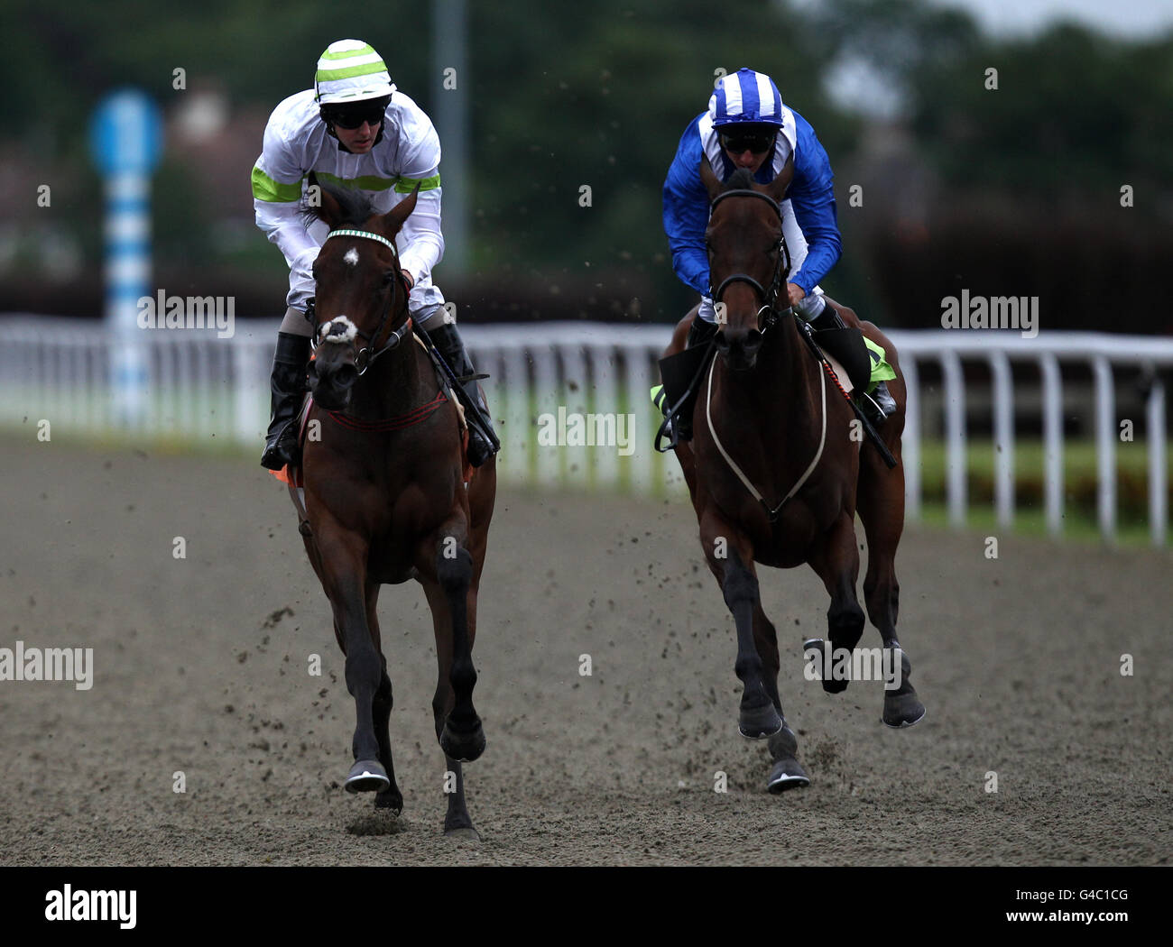 Jockey Tom Queally on Neumark (left) comes home ahead of Eddie Ahern on ...