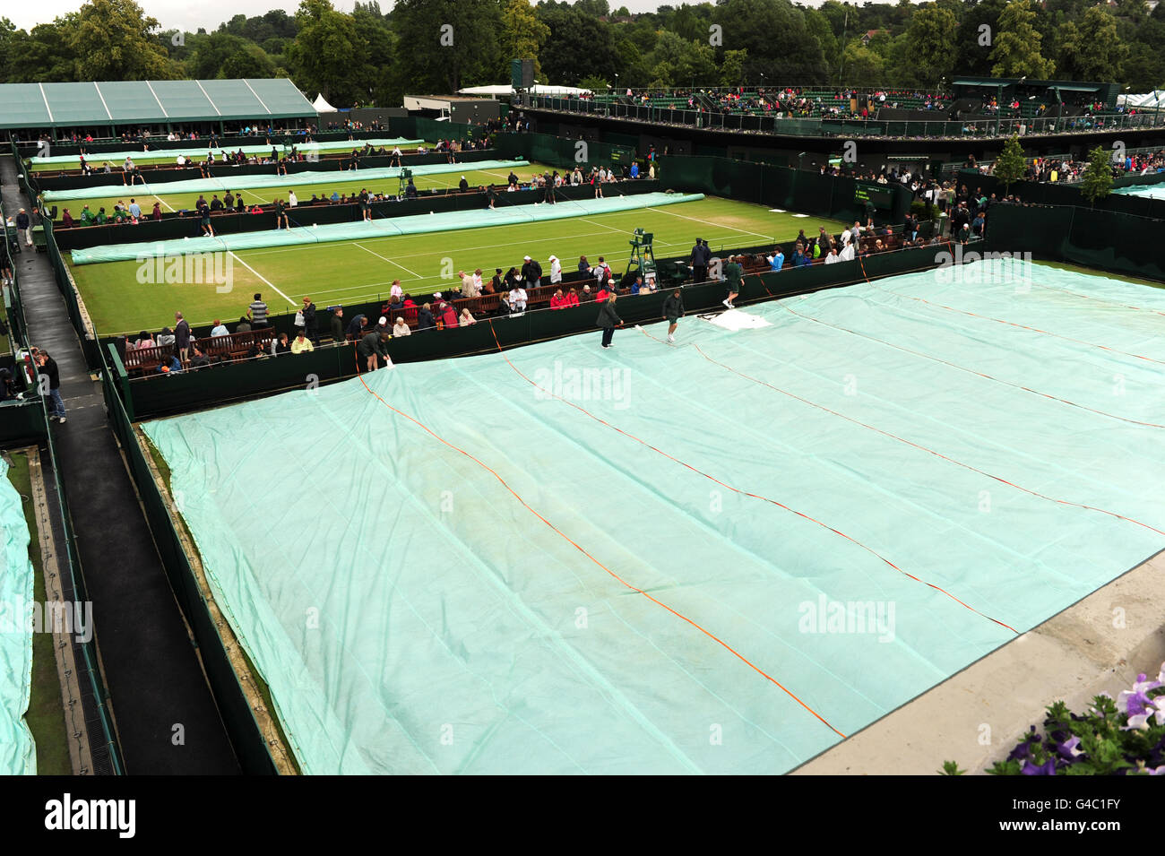 A general view of the outside courts at Wimbledon as the covers are ...