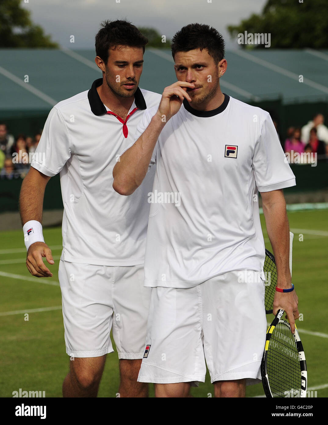 Great Britain's Josh Goodall and Chris Eaton (left) leave the court ...