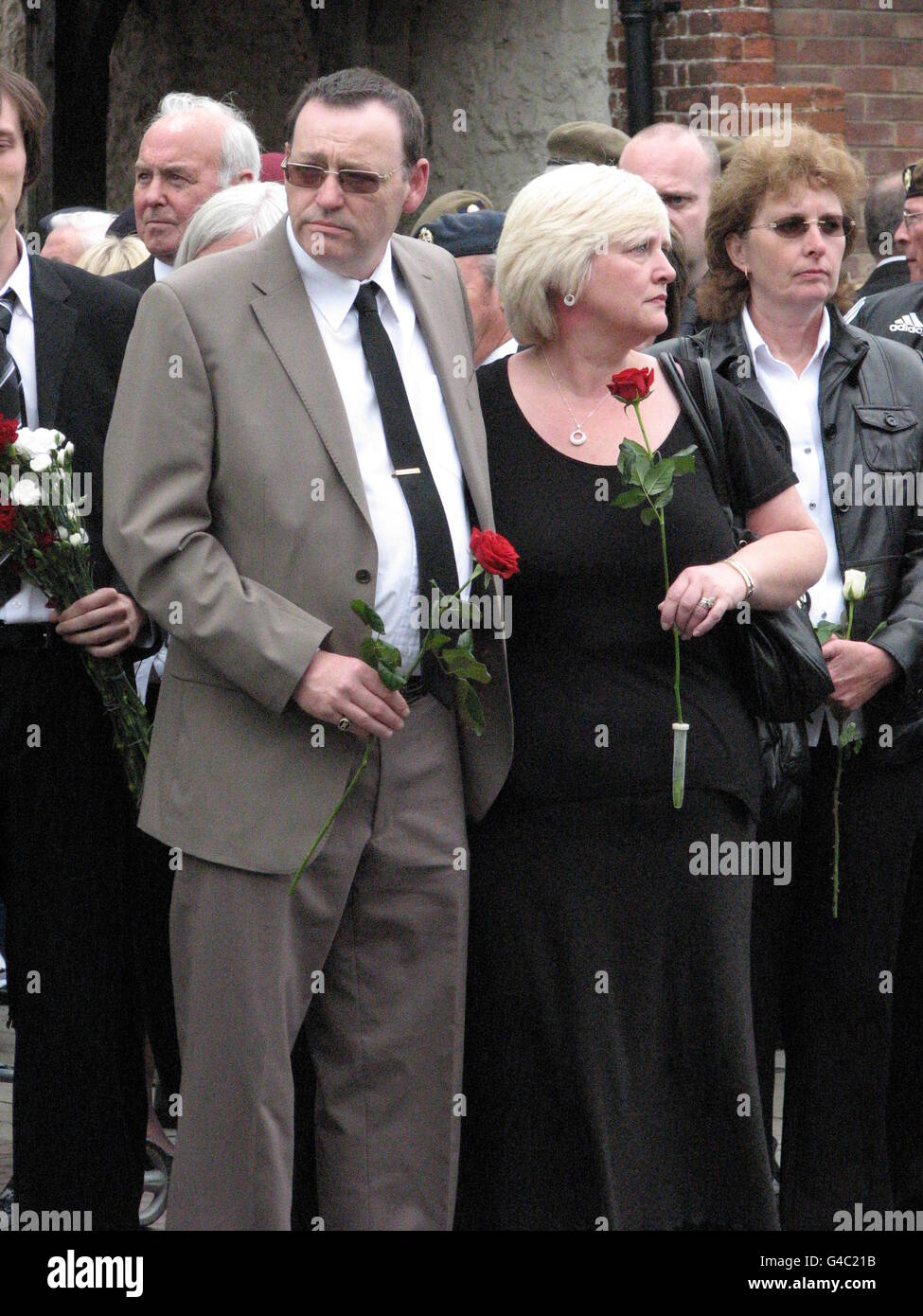 Leslie and Suzanne Bellingham, stand as their son's body, Private ...