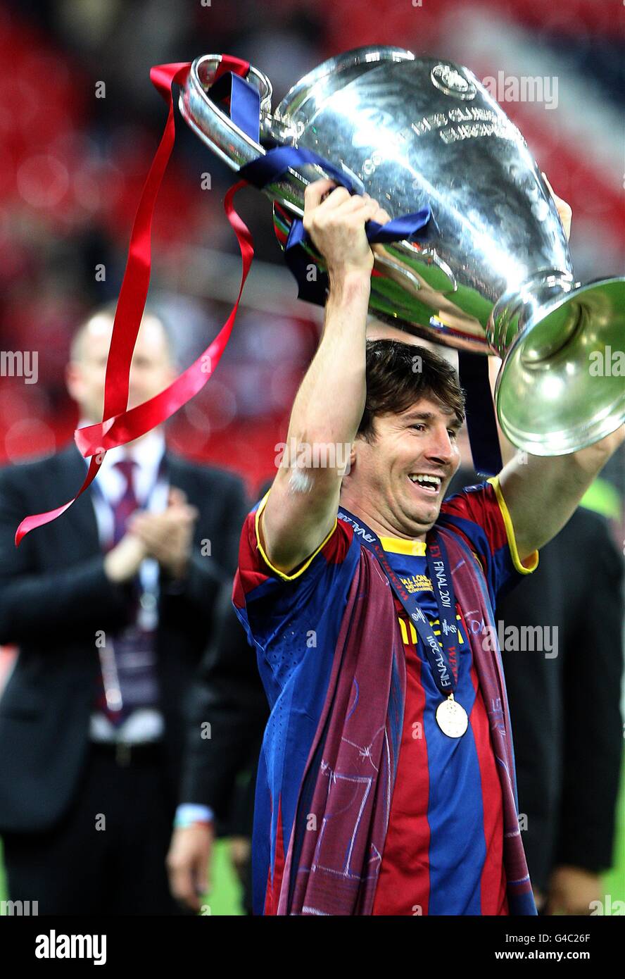 Barcelona's Lionel Messi celebrates with the trophy after the final ...