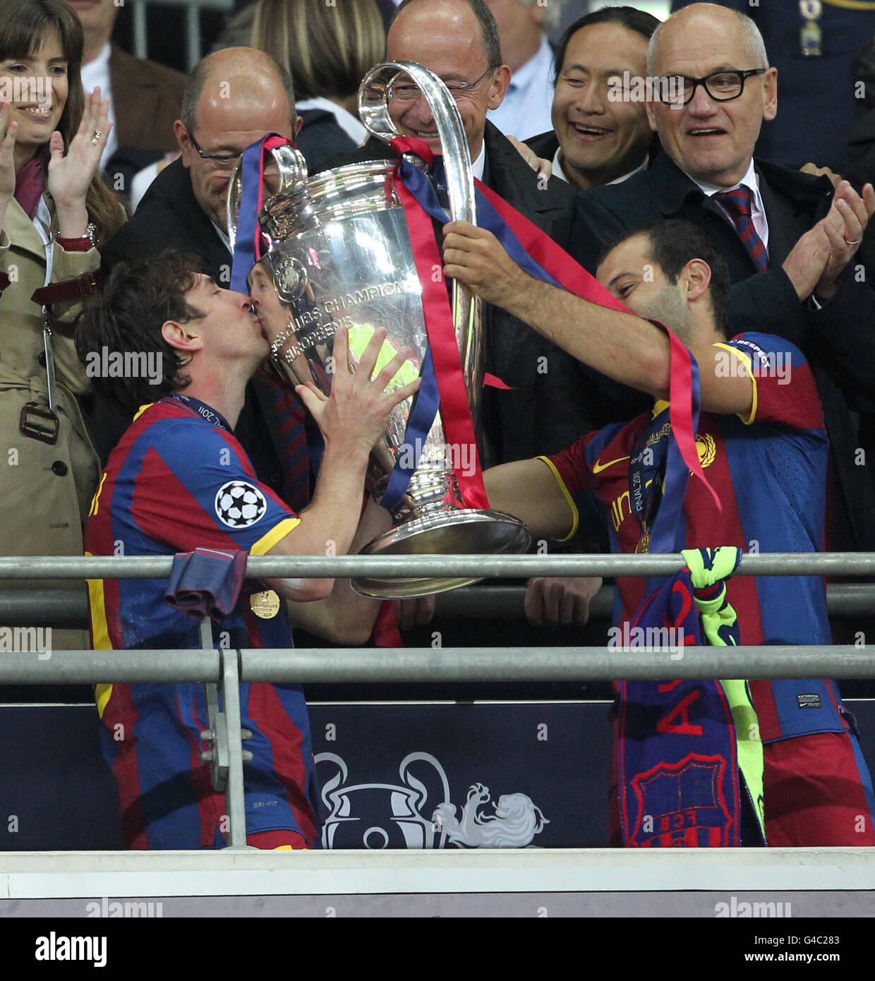 Barcelonas lionel messi celebrates kissing the champions league trophy ...