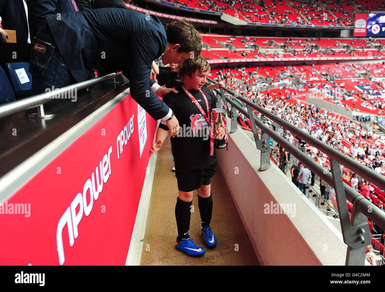 The runners up team receive the trophy for the kids cup final, prior to ...