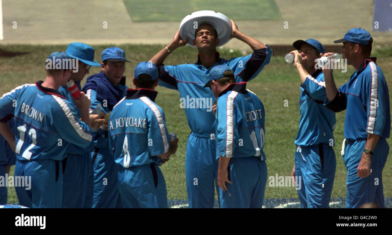 Dean Headley (centre) with the top of the drinks box on his head, at ...