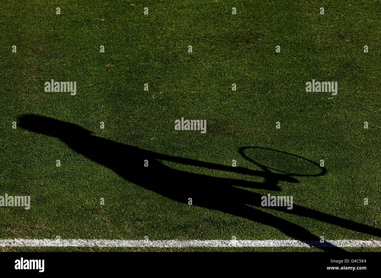 A generic shot of a tennis players shadow during the match Stock Photo ...