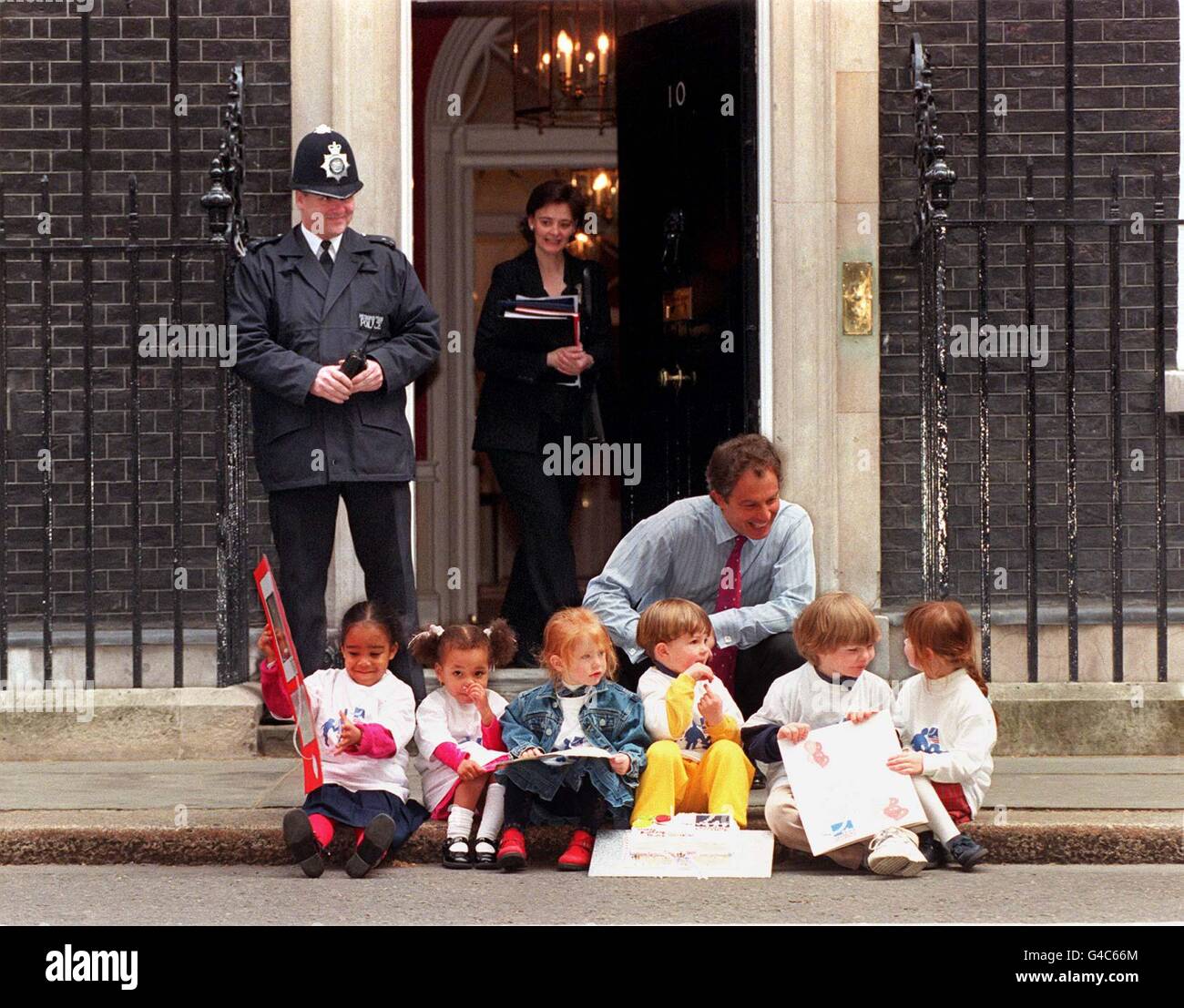 Cherie Booth looks out on husband Prime Minister Tony Blair talking to ...