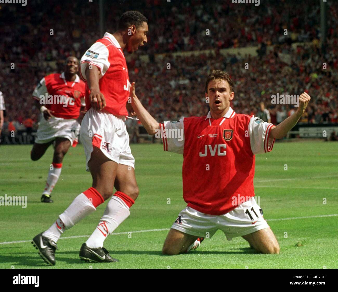 Nicolas Anelka rushes to congratulate Marc Overmars after scoring the ...