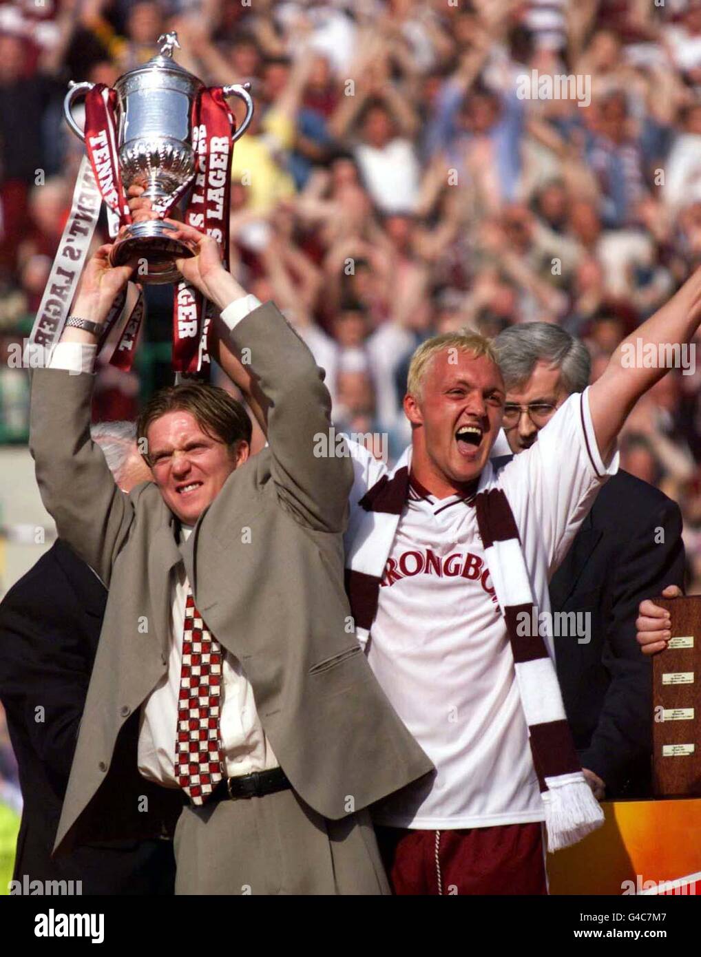 Heart's Steve Fulton (right) and Gary Lock holds up the Tennants ...
