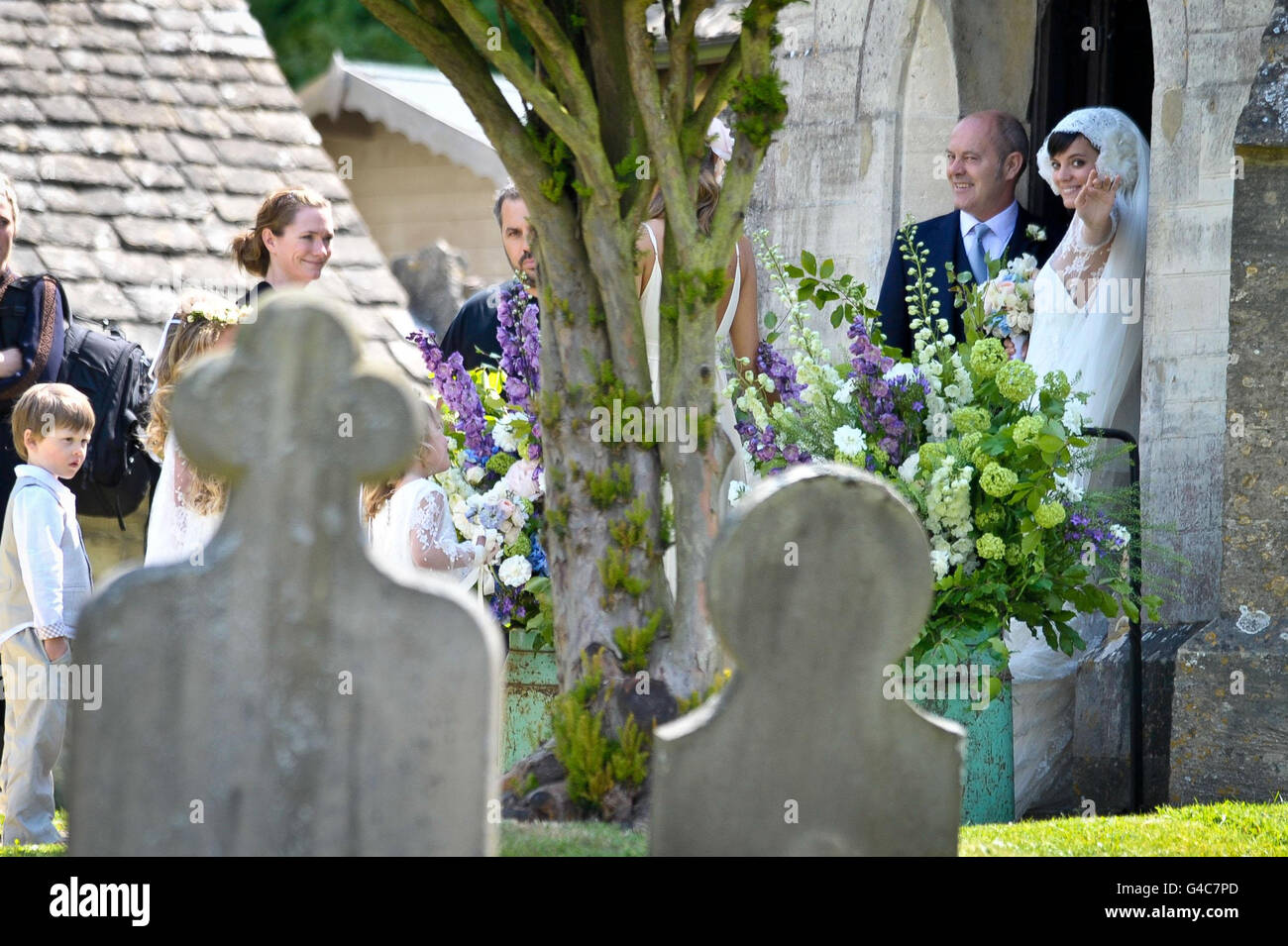 Lily Allen and her father Keith Allen stand at the door of St James The ...