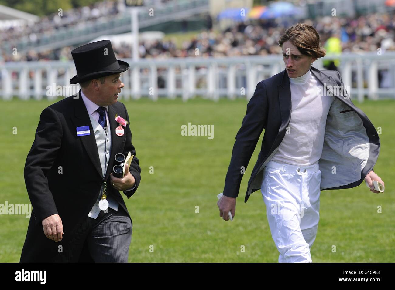 Jockey Denis Sweeney (right) walks the course during Day Five of the ...