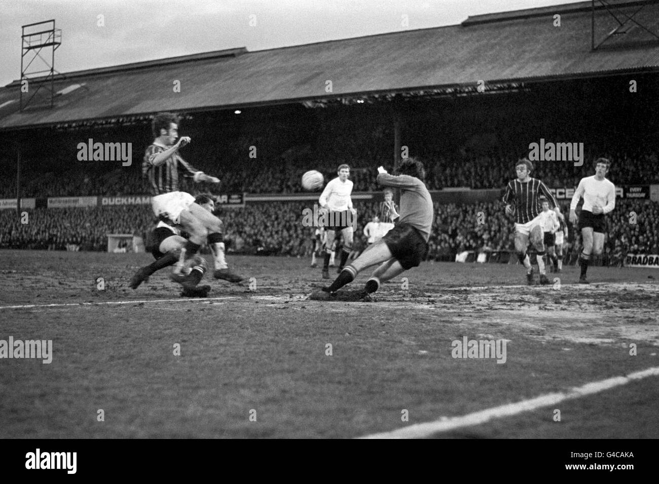 Manchester City goalkeeper Joe Corrigan saves at the feet of Crystal ...