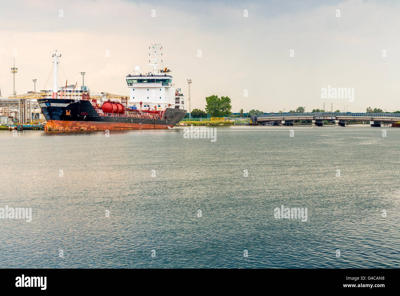 cargo ship docked in the port channel Stock Photo - Alamy