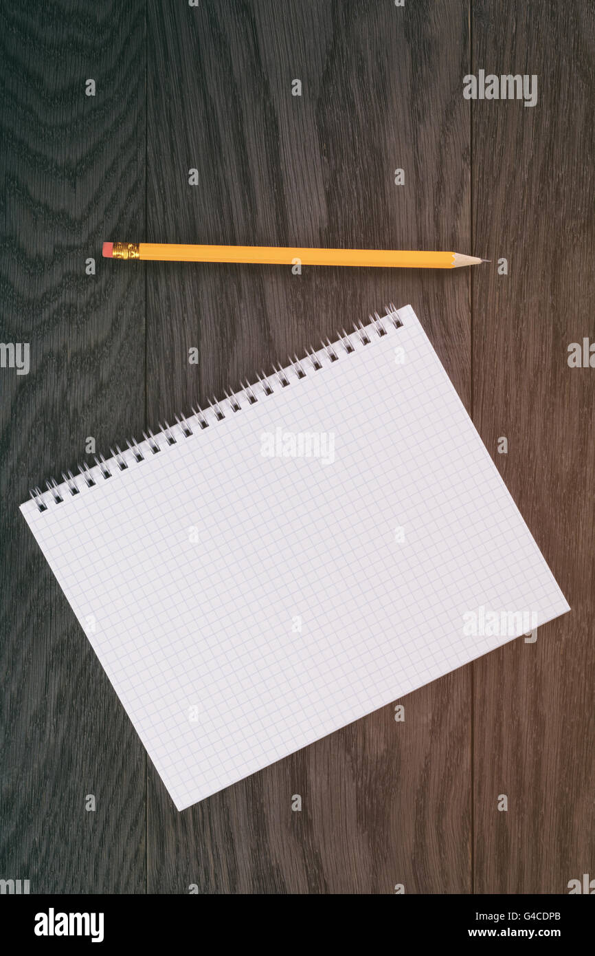 blank notepad on wood table Stock Photo - Alamy