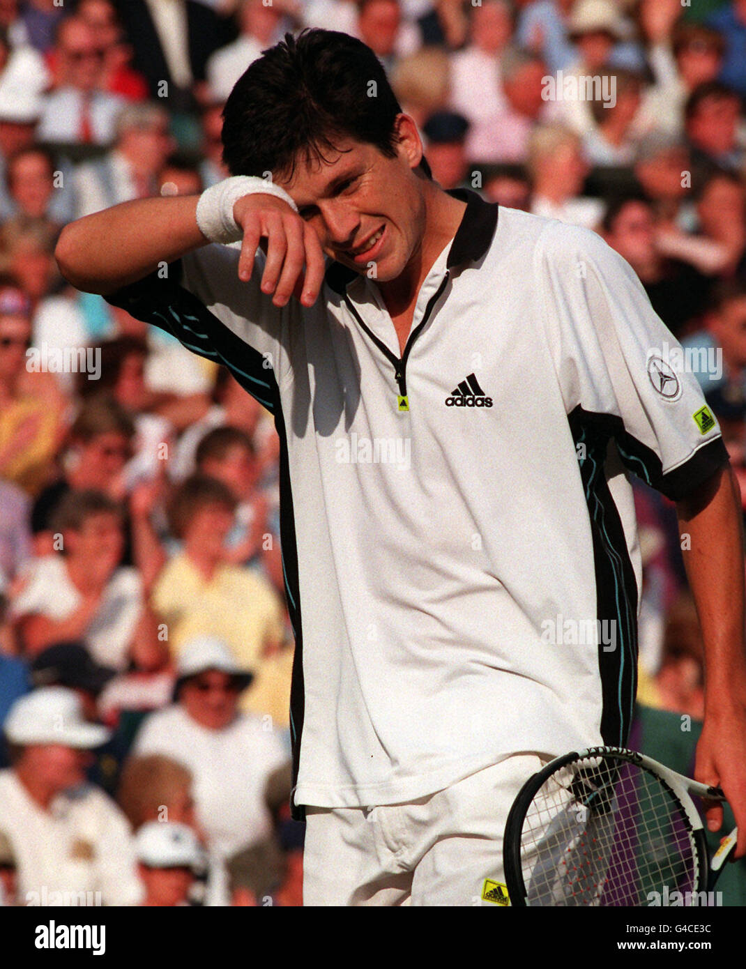 Britain's Tim Henman appears to be feeling the pressure at Wimbledon ...