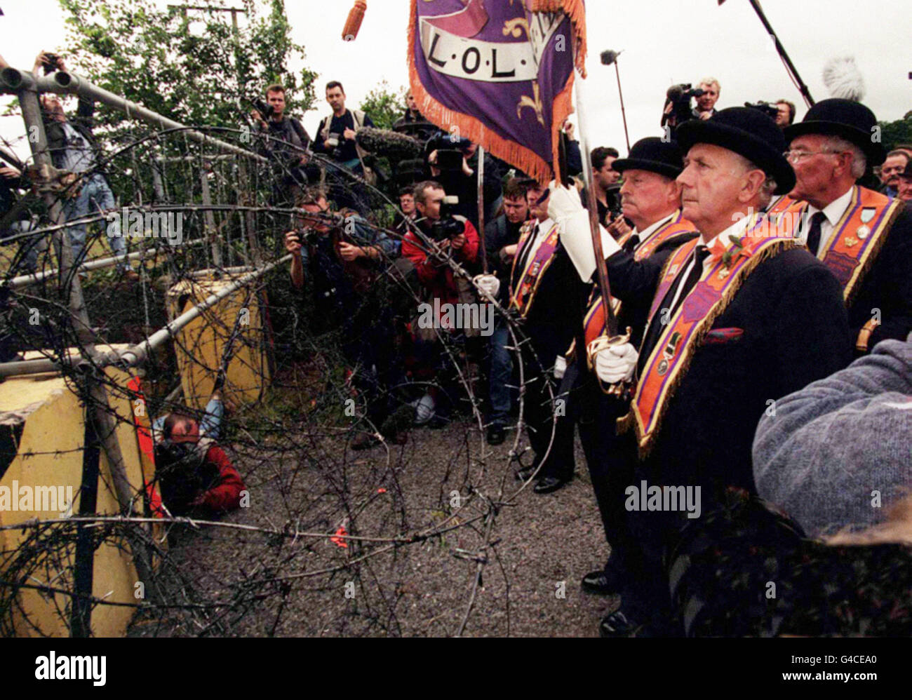 Members of the Portadown Lodge of the Orange Order are stopped by a ...