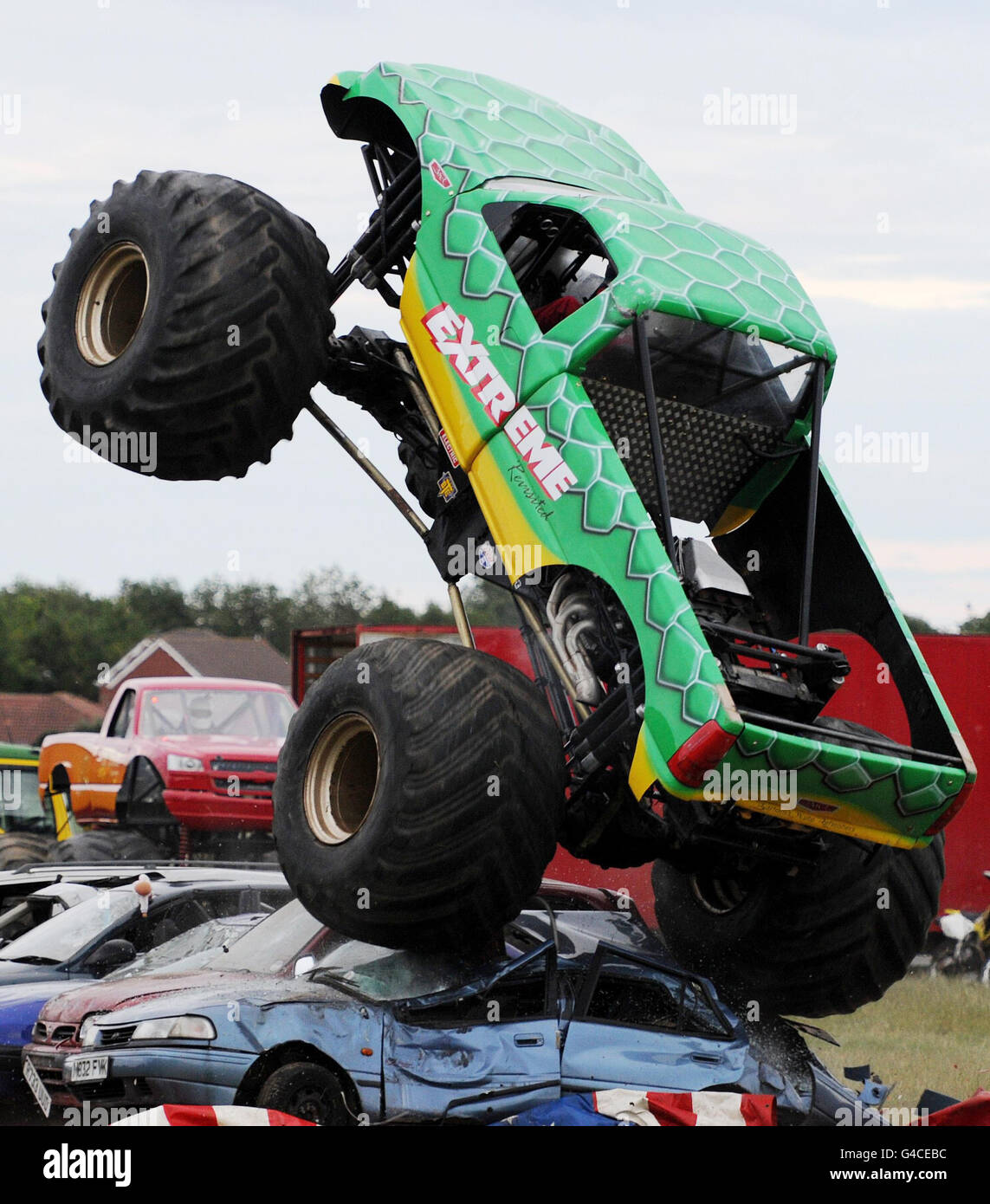 The Monster Truck from The Extreme Stunt Show drives over vehicles at a ...