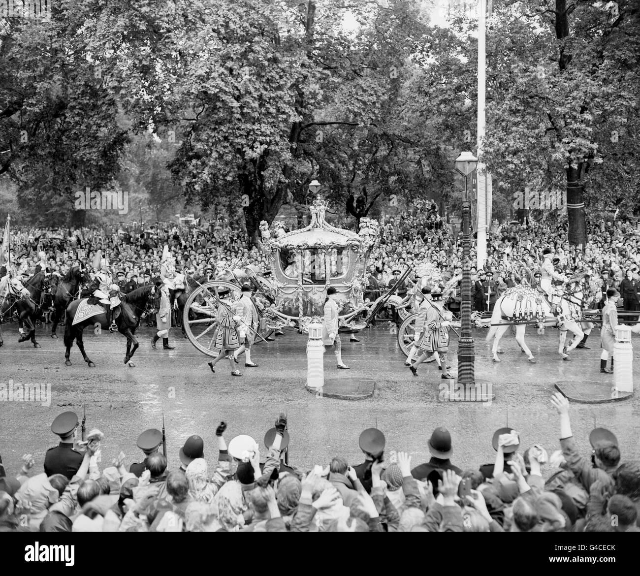 The State Coach bearing Queen Elizabeth II in the Coronation procession ...