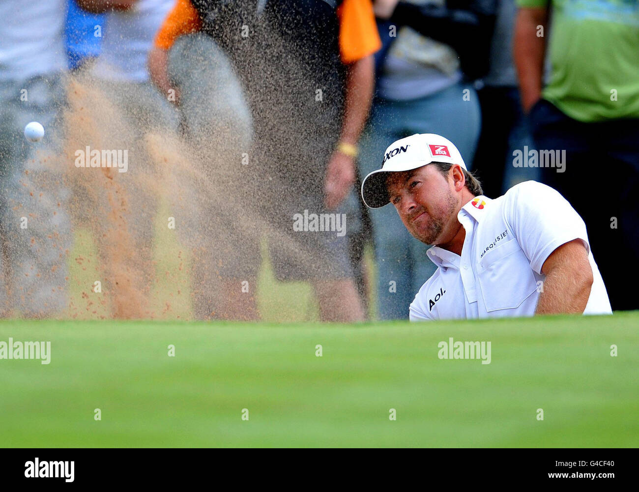 Northern Ireland's Graeme McDowell plays out of a bunker during day ...