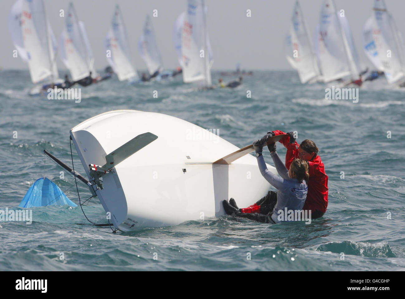 Capsized sailing dinghy hi-res stock photography and images - Alamy
