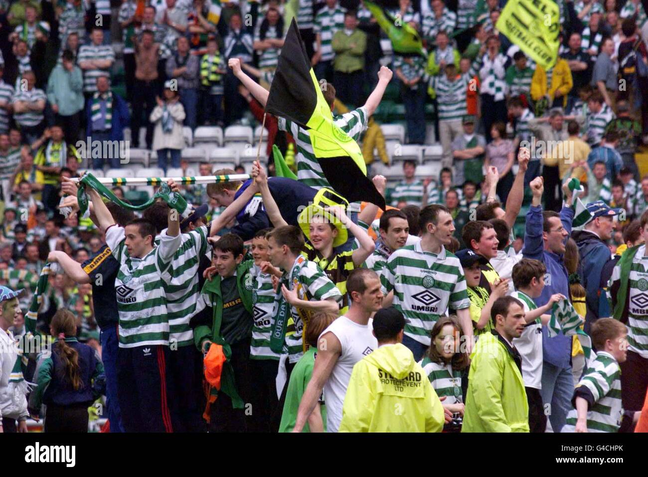 Celtic fans celebrate after their team won the Premier League Cup at ...