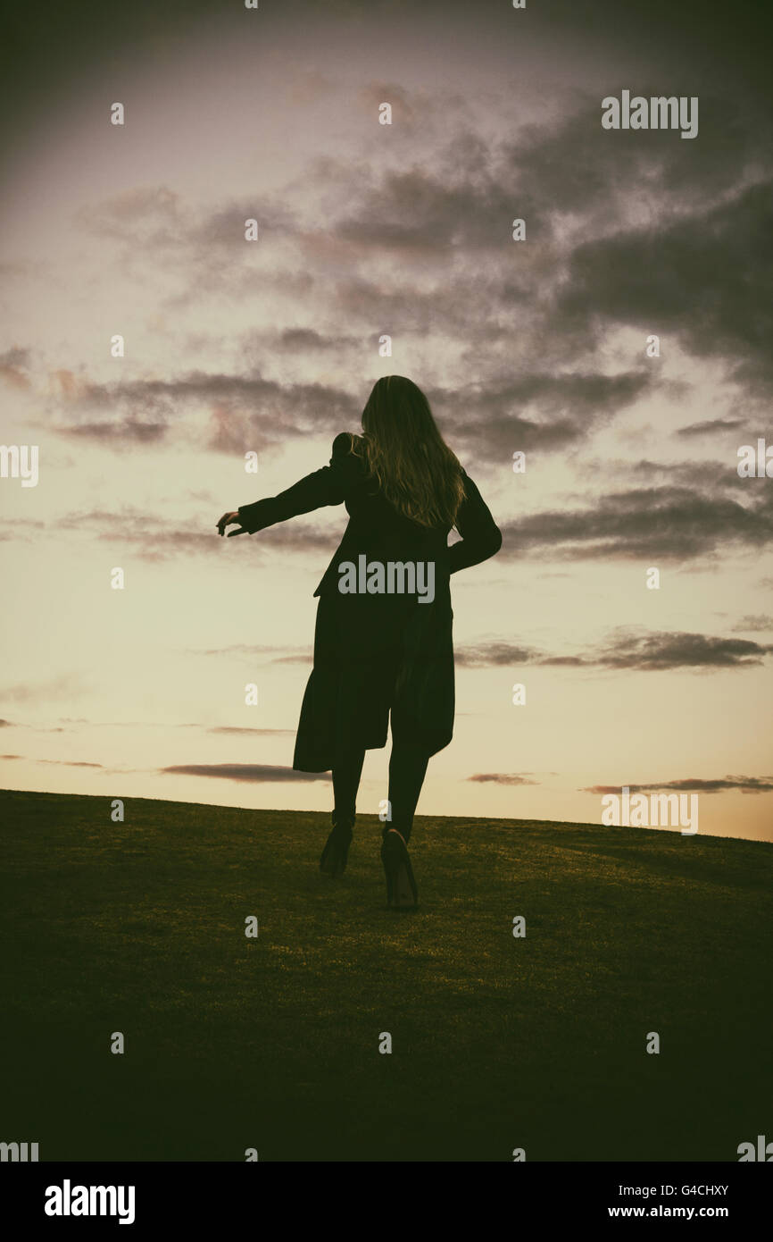 Woman running away danger hi-res stock photography and images - Alamy