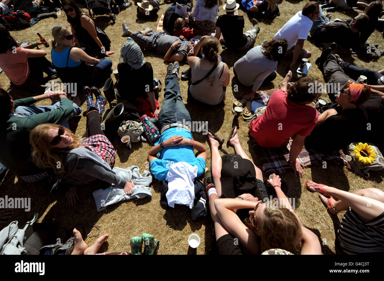 Festival goers enjoy the hot weather during the second day of the Isle ...