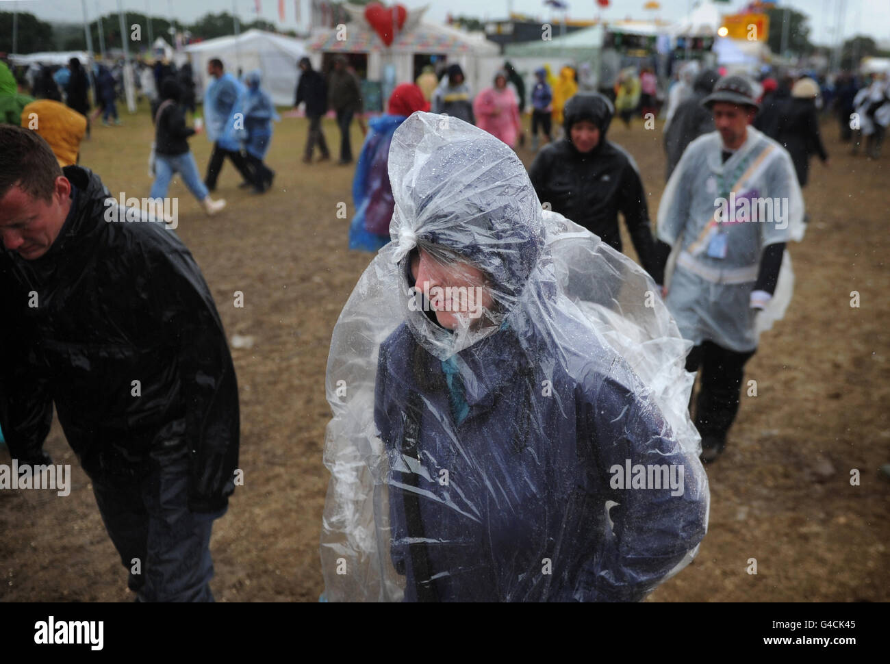 Festival goers brave the wet weather during the final day of the Isle ...
