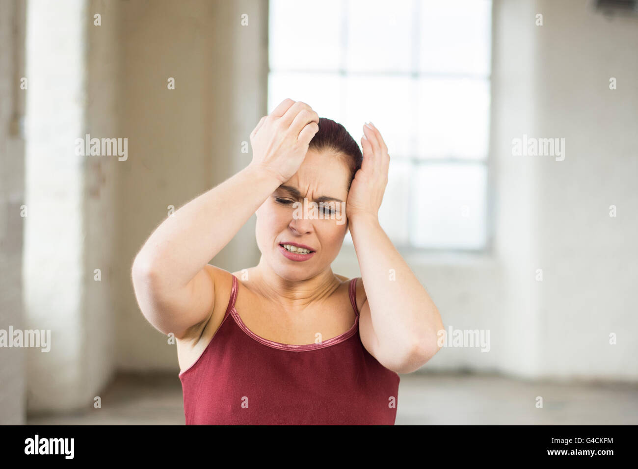 Distressed woman head in hands Stock Photo - Alamy