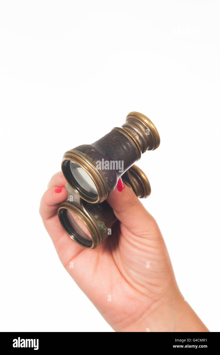 Close up of a woman's hand holding binoculars Stock Photo - Alamy