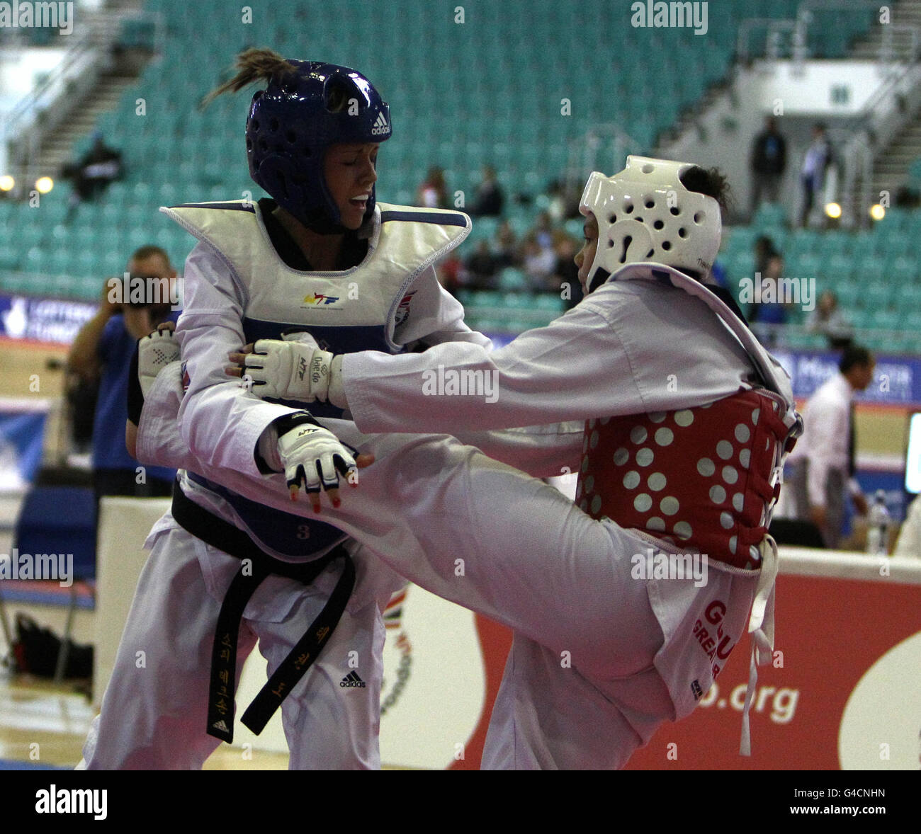 Great Britain's Sophie Dickson (blue) in action against England's ...