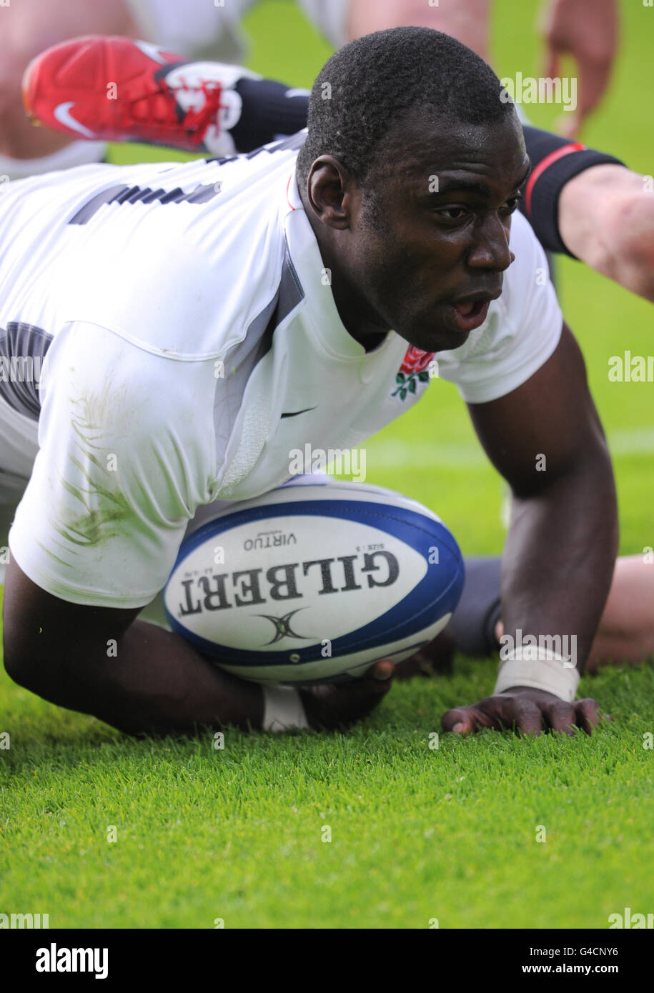 England's Miles Benjamin scores his second try against Canada during ...
