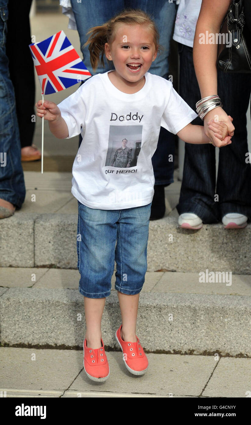 Saharah McKay waits for the arrival of her father at the homecoming for ...