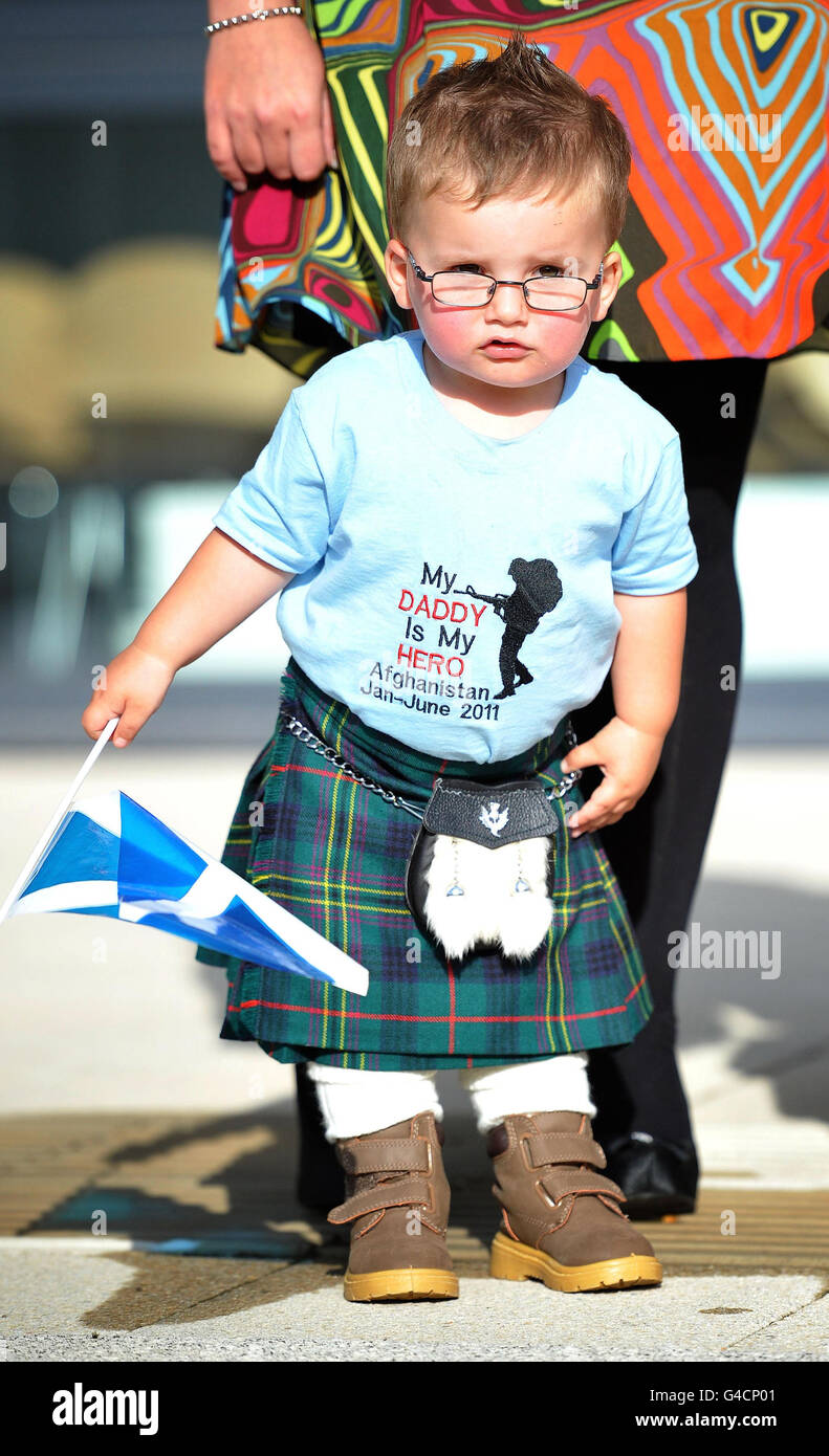 One-year-old Connor McCaig waits for the return of his father at the ...