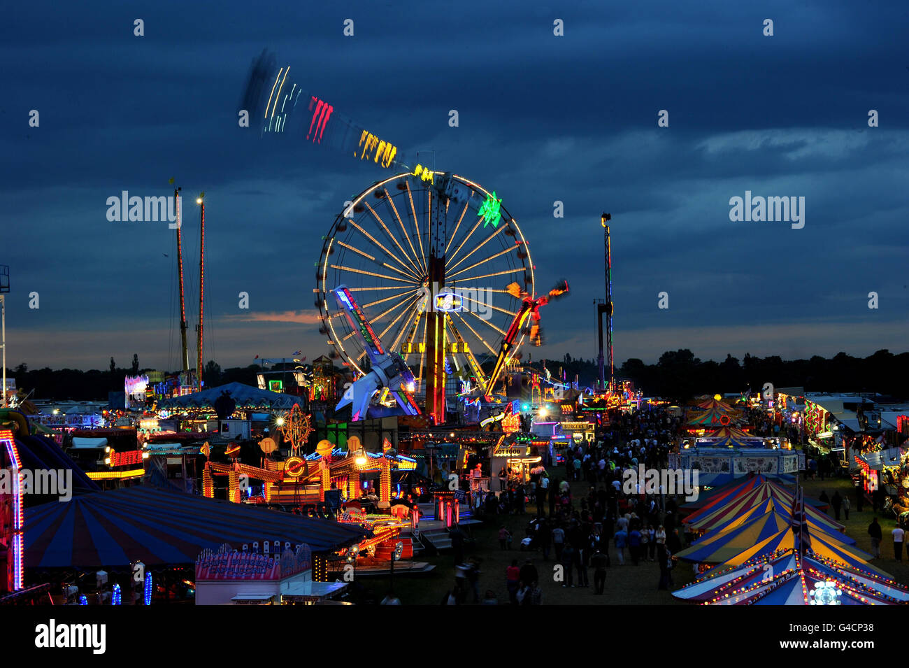The bright lights of Hoppings Fair are seen in the evening light in ...