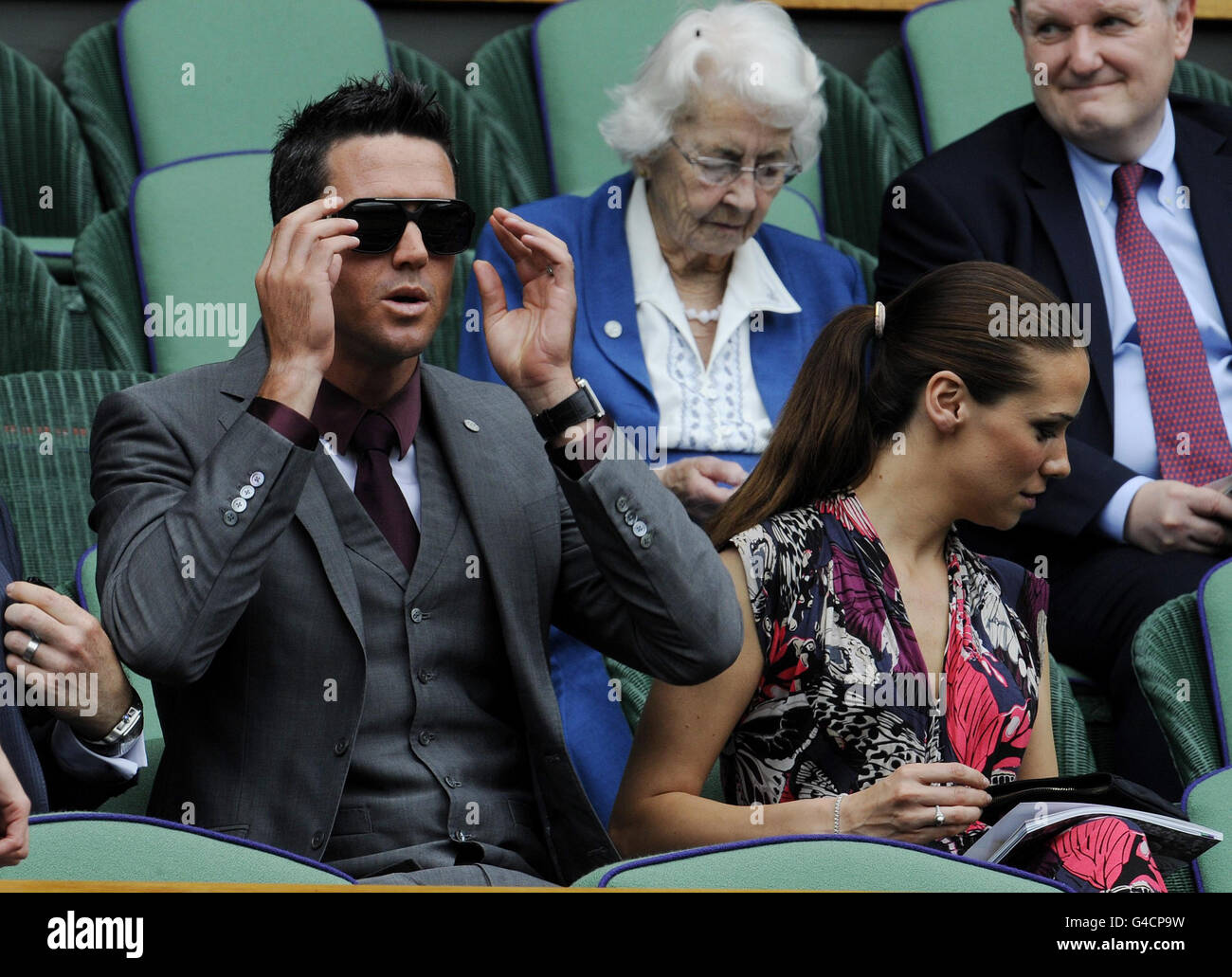 Cricketer Kevin Pietersen arrives in the Royal Box with his wife ...