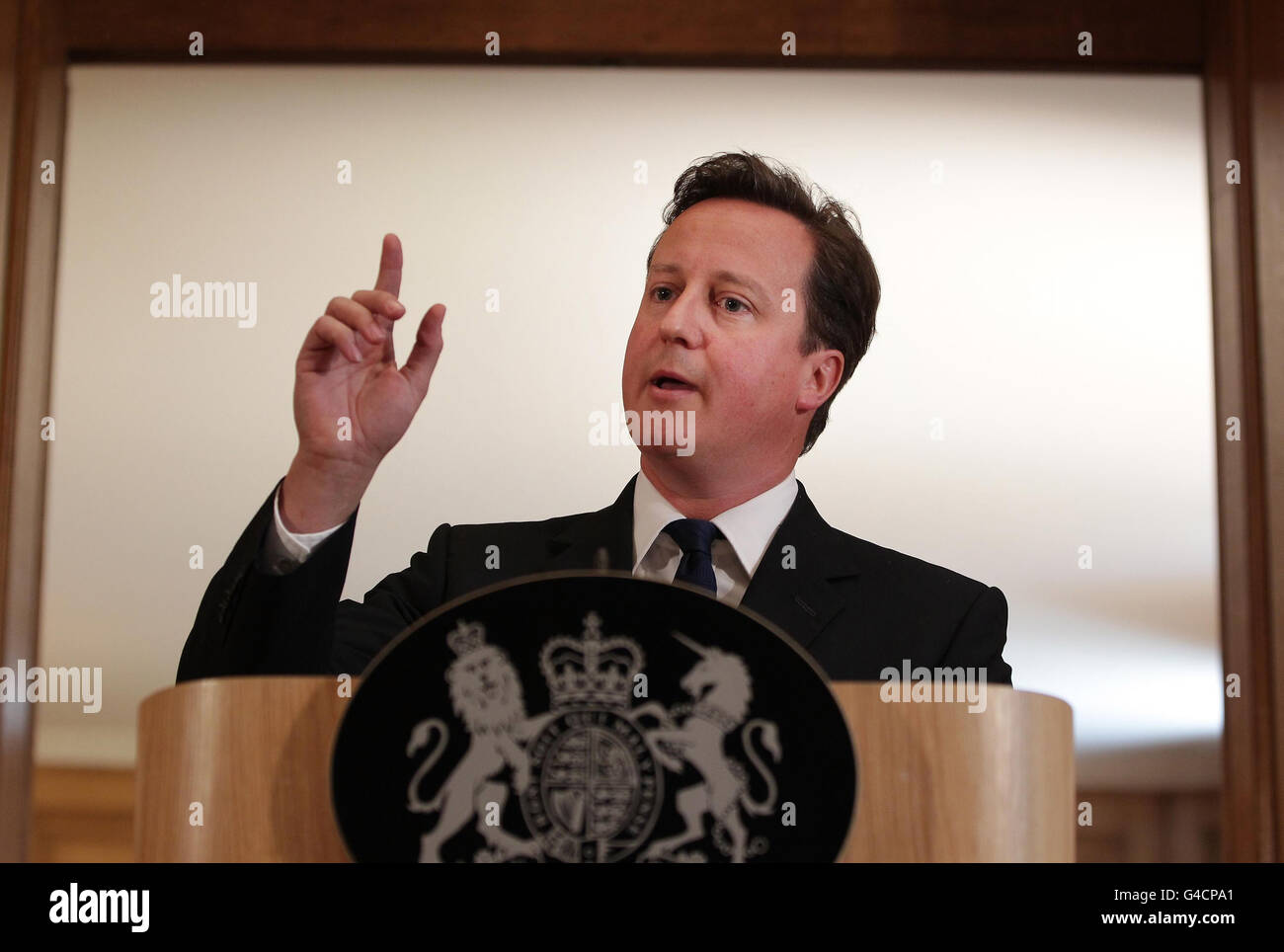 Prime Minister David Cameron speaks to reporters at 10 Downing Street ...