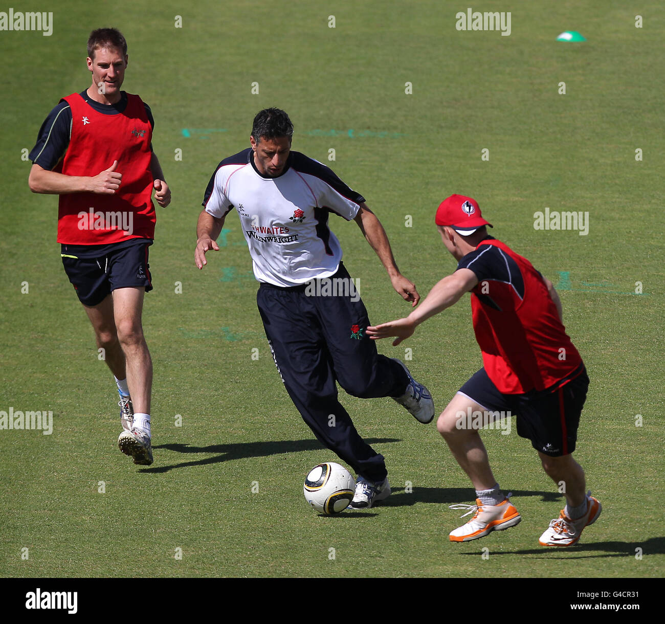 Lancashire's Sajid Mahmood (centre) plays football with Mark Chilton ...