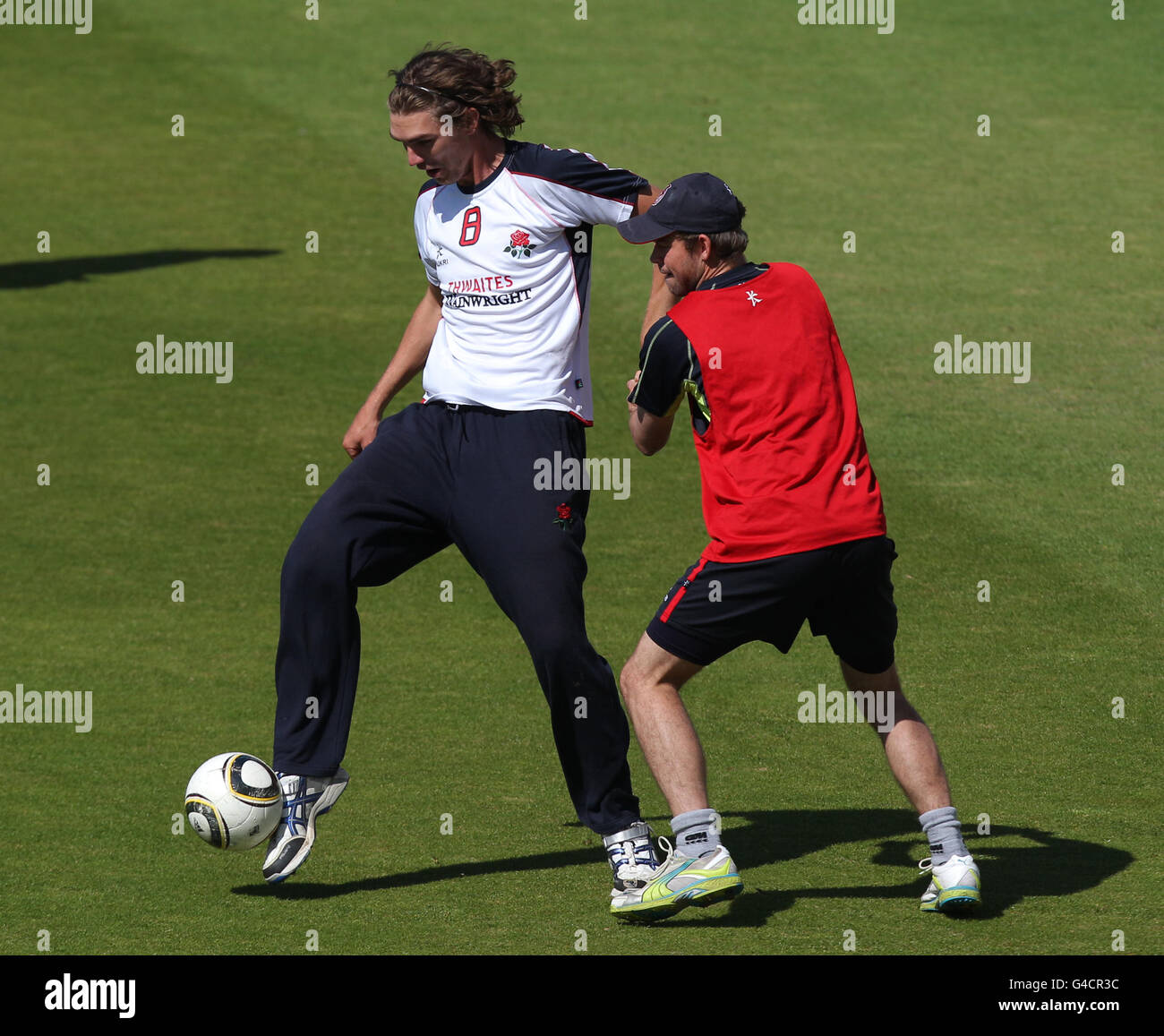 Lancashire's Oliver Newby (left) plays football with Gareth Cross ...